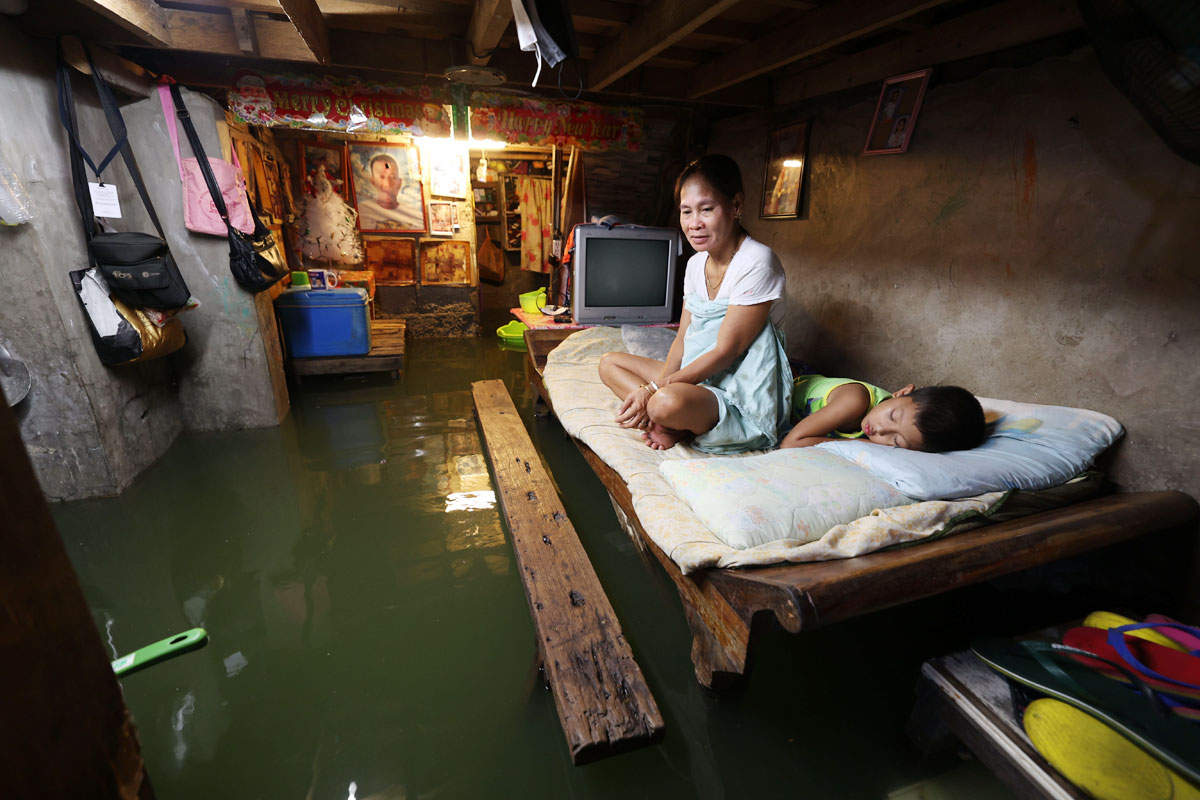 IN PHOTOS: Living Amid Flood In Hagonoy, Bulacan | OneNews.PH